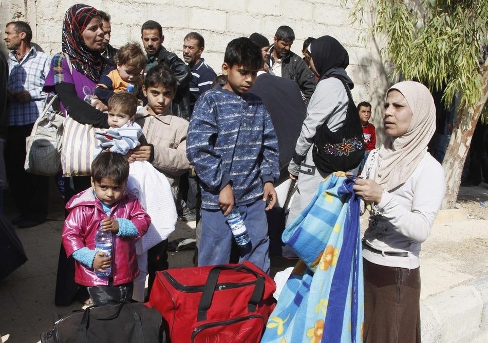 Thousands Of Starving Syrians Flee A Damascus Town That Was Cut Off ...