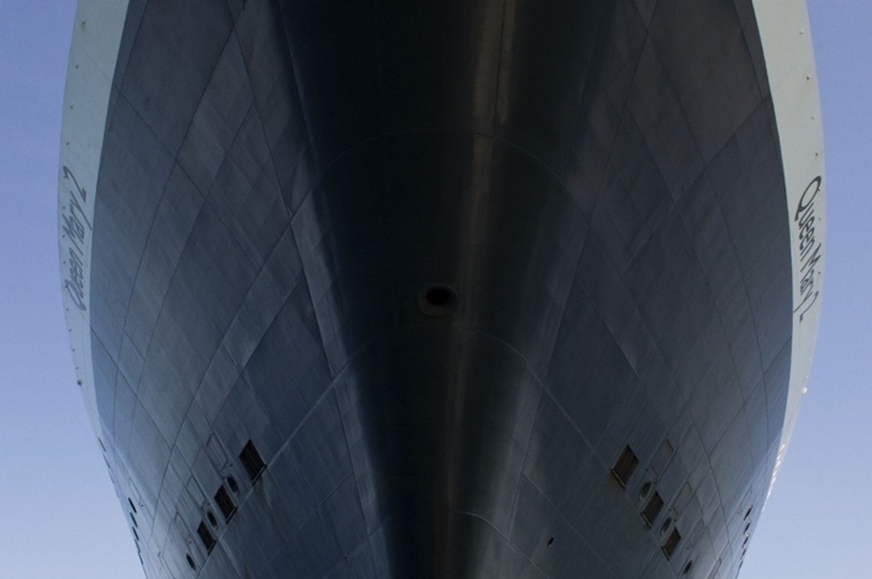 Captain Poses For Epic Picture On Bow Of His Huge Ship