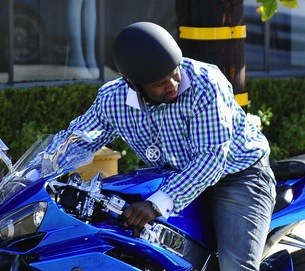 Can You Guess Who's Riding The Motorcycle?
