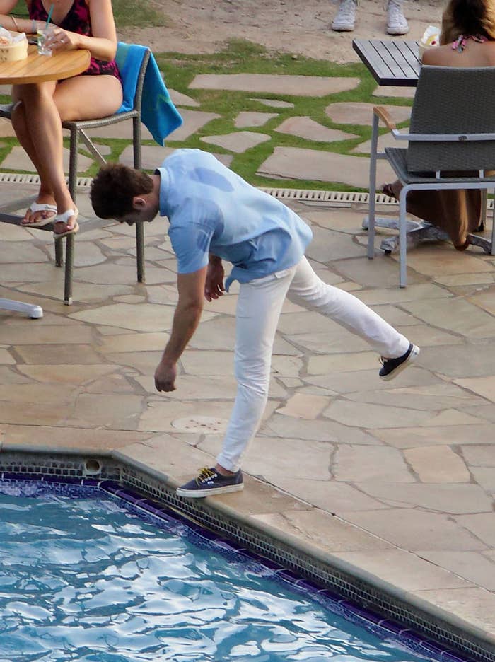 Zac Efron Walks Into A Pool