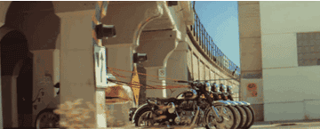 Macklemore's New Moped-Centric Music Video Is Goofy As Hell