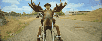 Macklemore's New Moped-Centric Music Video Is Goofy As Hell