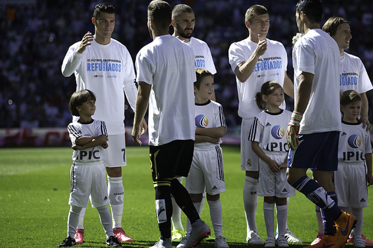 Cristiano Ronaldo Brings Syrian Refugee Boy Onto Soccer Field