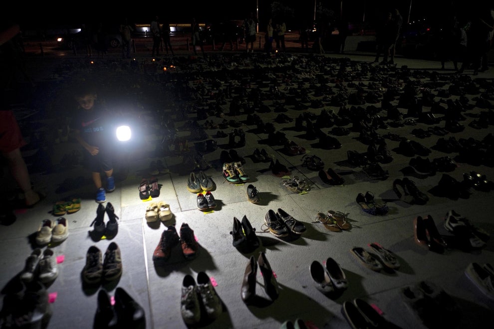 These Moving Photos Show Empty Pairs Of Shoes Marking The Dead In ...