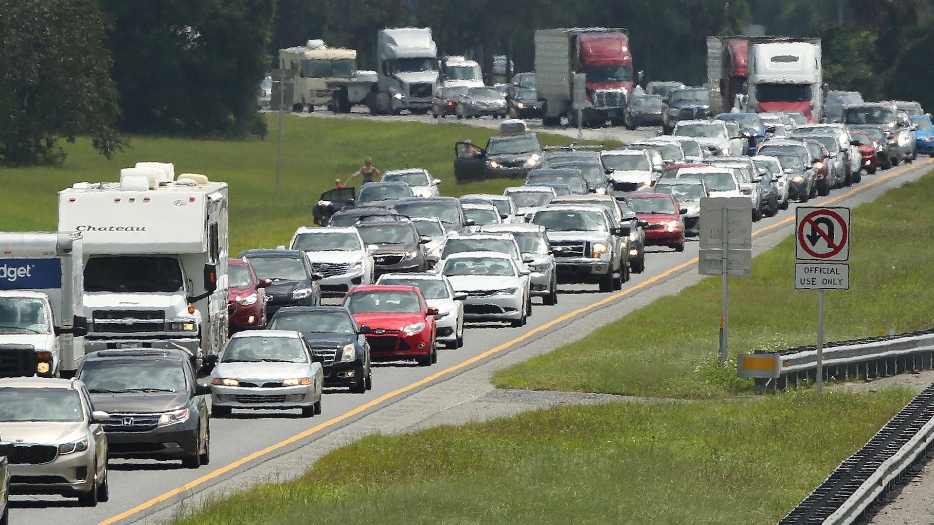 Video Shows Man Clinging to the Hood of a Moving Semi-Truck | Complex