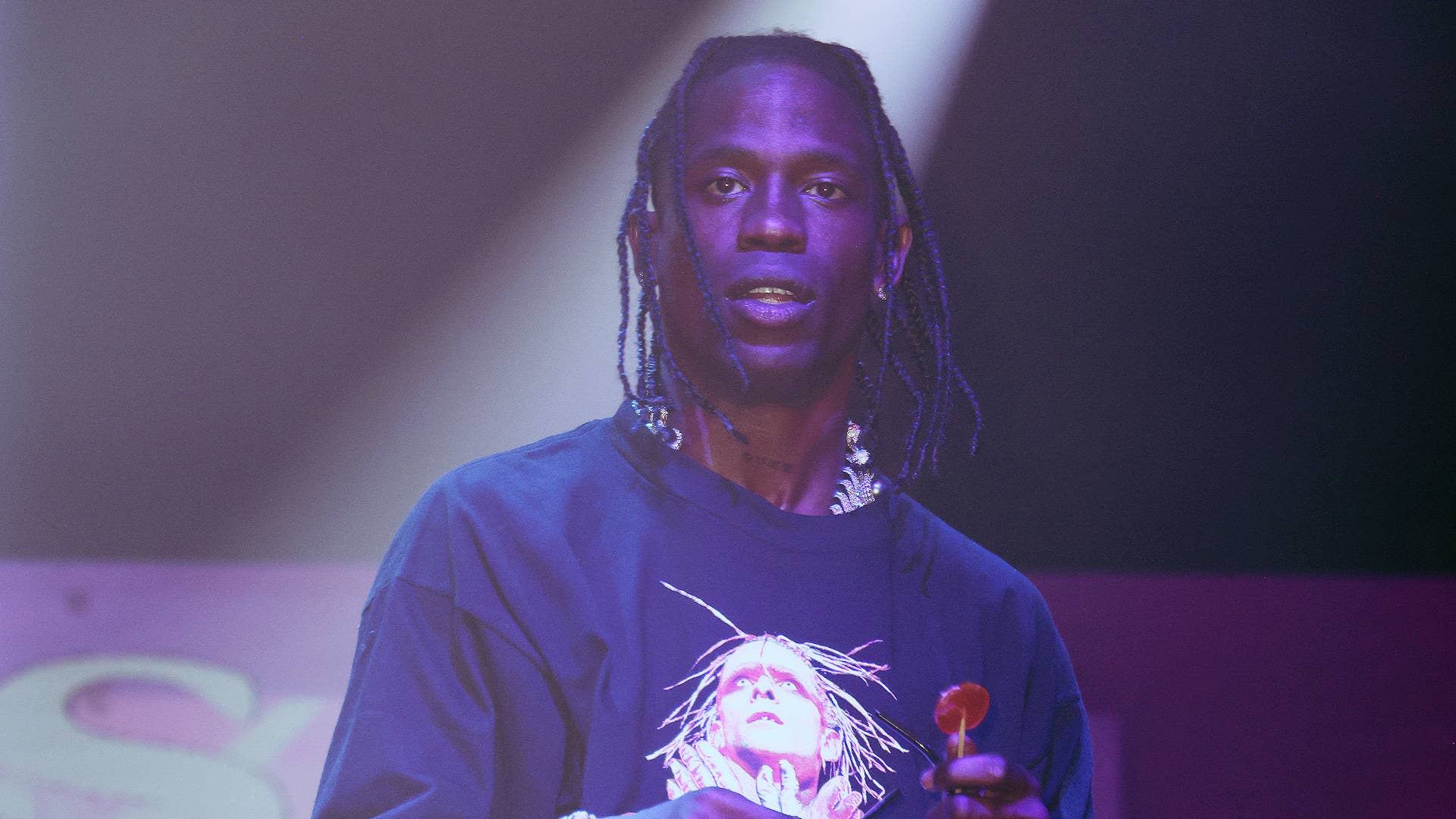 Travis Scott Uses Handcuffed Guard to Hold 'Utopia' in Suitcase | Complex