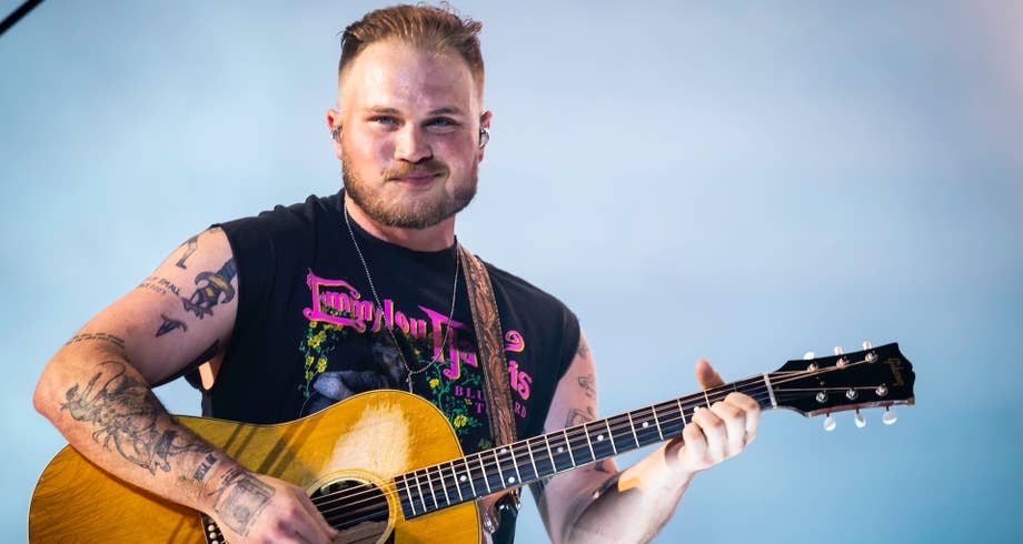 Watch Zach Bryan Bring 'Hawk Tuah' Girl Onstage to Sing "Revival" | Complex