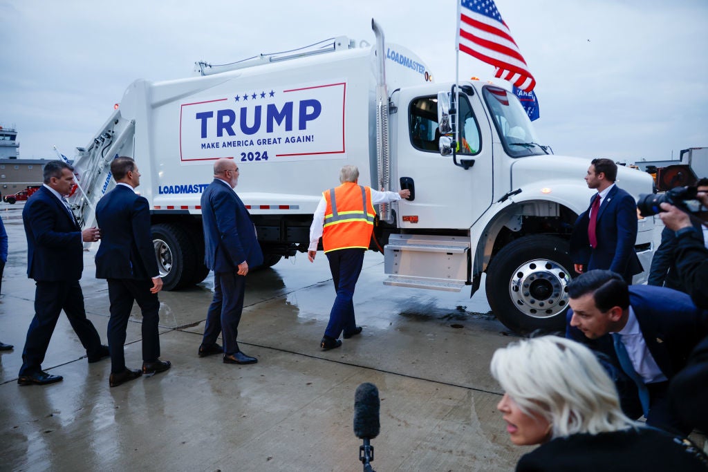 Donald Trump Struggling To Get Into That Garbage Truck Is Going Viral