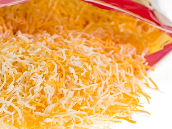 Wash Your Pre-Shredded Cheese For More Even Melting