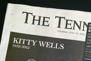 Unfortunate Newspaper Sticker Ad Placement