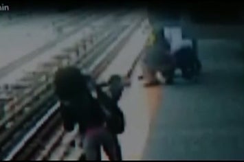 Baby In A Stroller Rescued After Falling Onto The Train Tracks