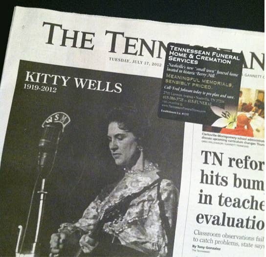 Unfortunate Newspaper Sticker Ad Placement