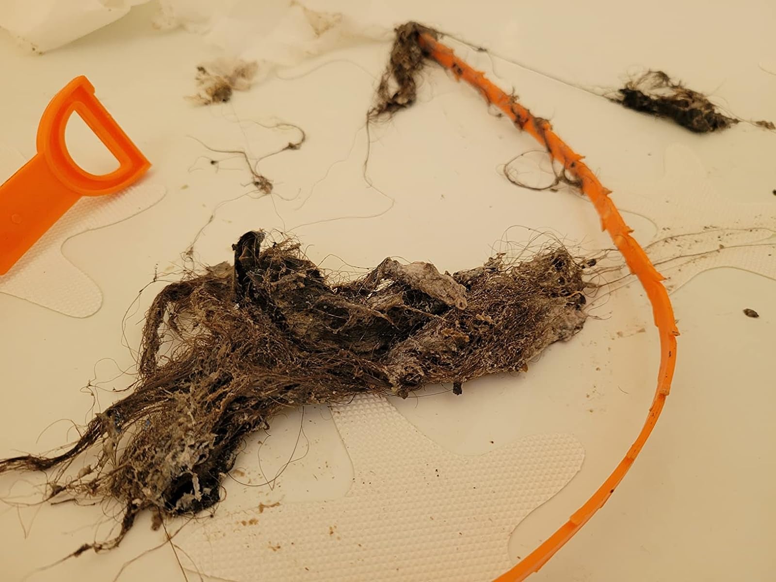 12 Solutions For Unclogging Hair From Drains