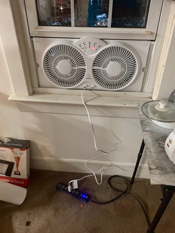 13 Best Window Fans For Keeping Things Nice And Breezy